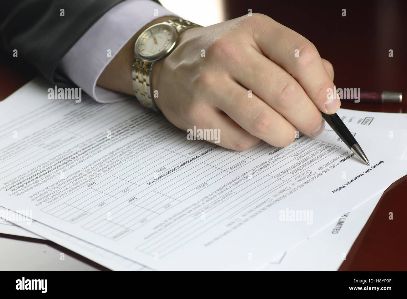 hand signed insurance Stock Photo - Alamy
