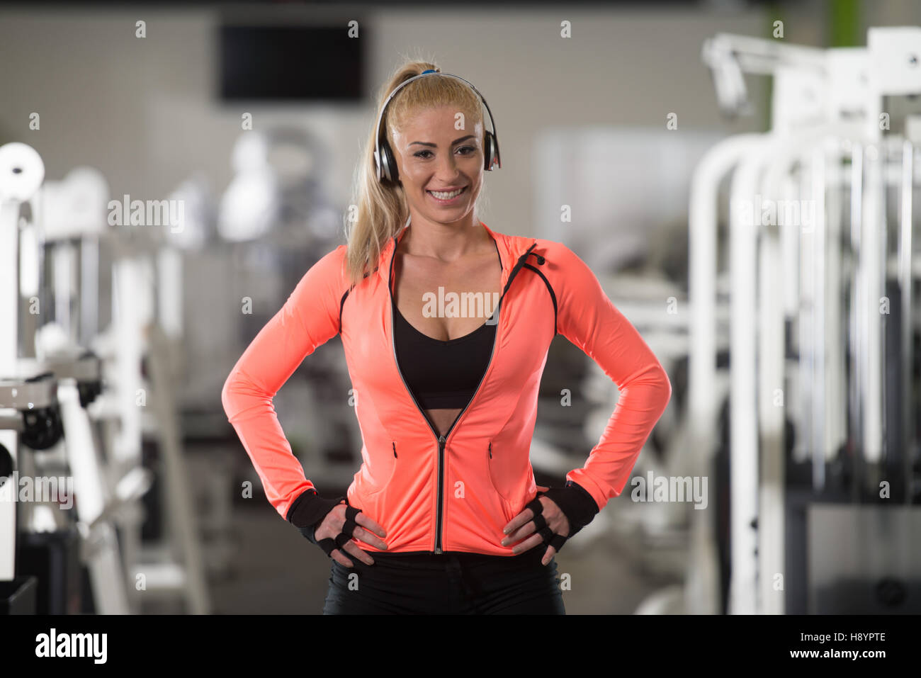 Healthy Young Woman Listening Music From His Mp3 Player In Modern ...
