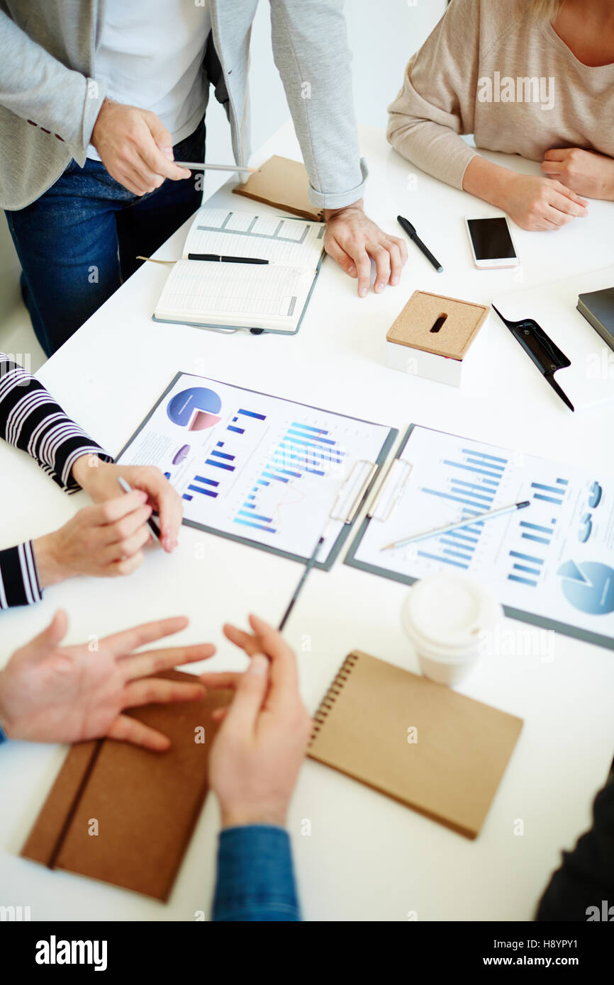 Financial documents on workplace during discussion Stock Photo - Alamy