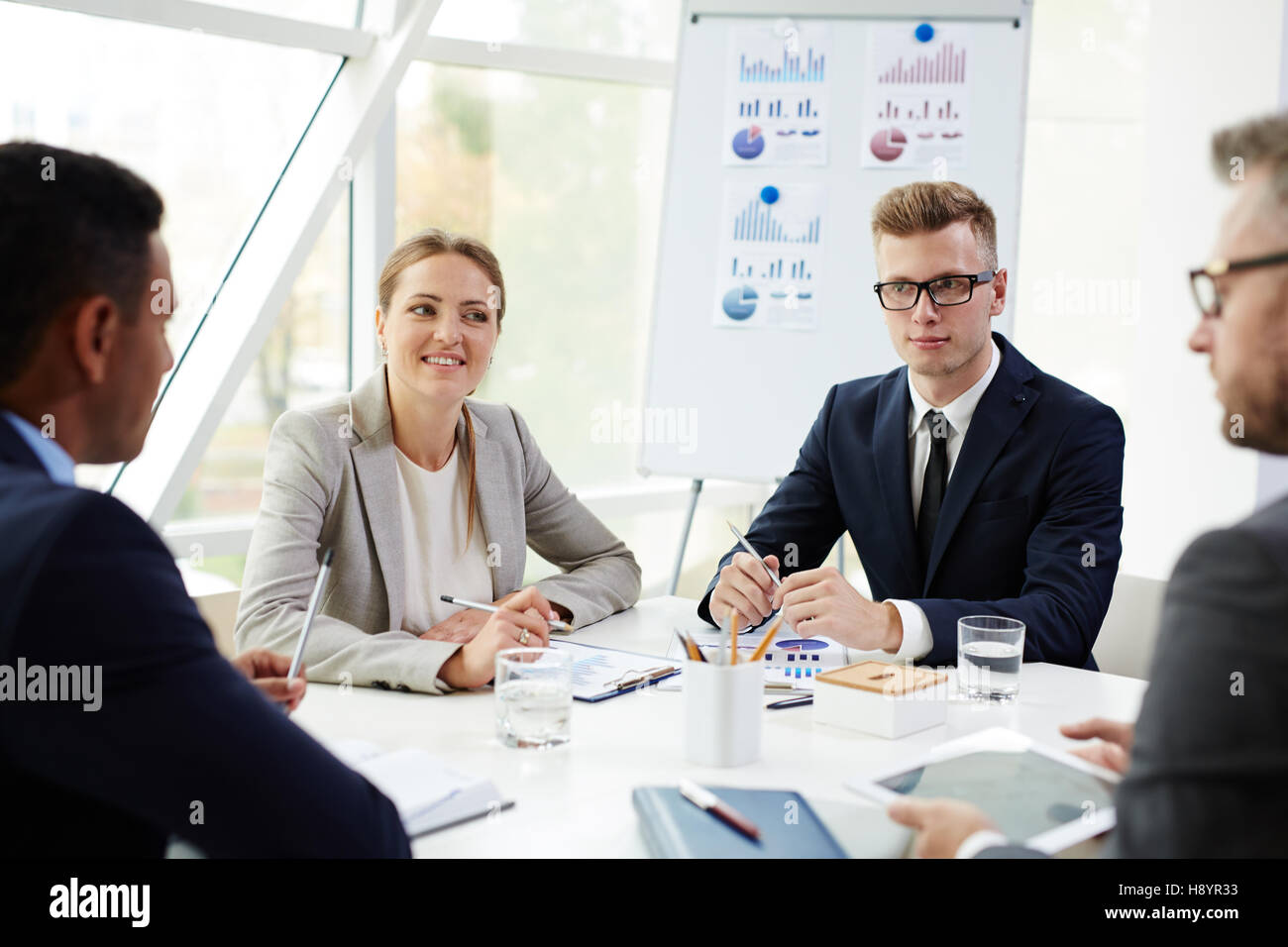 Group of managers analyzing financial changes in office Stock Photo - Alamy