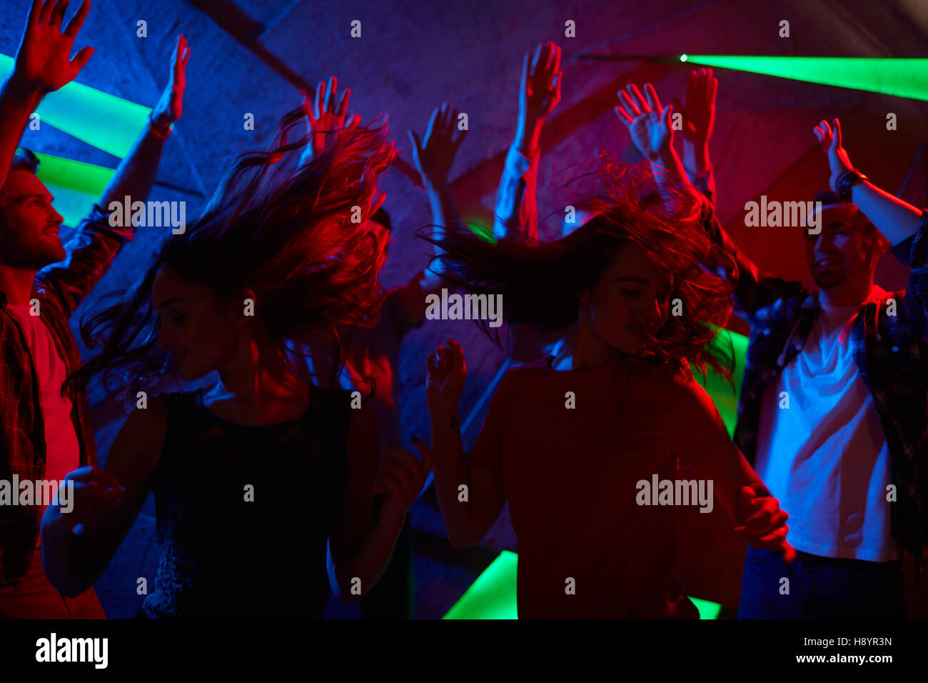 Crowd of young dancers clubbing together Stock Photo - Alamy