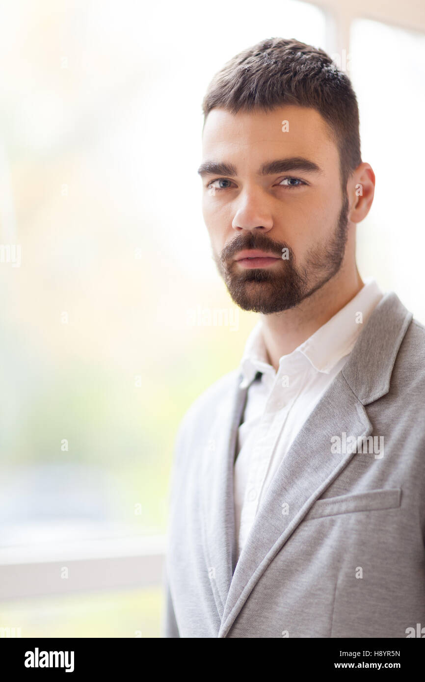Young bearded ceo looking at camera Stock Photo - Alamy