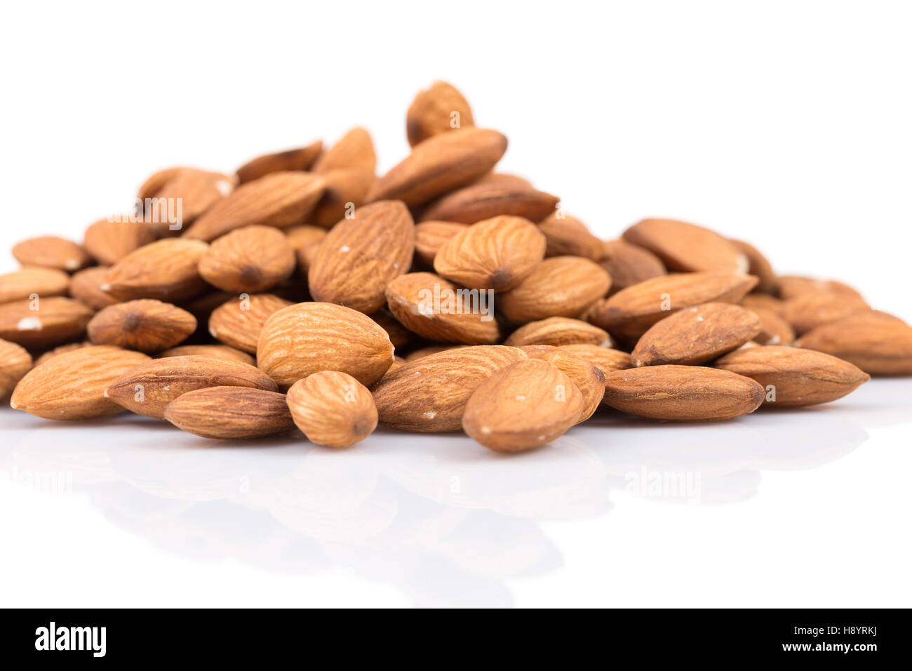 Composition from almond nuts isolated on white background Stock Photo ...