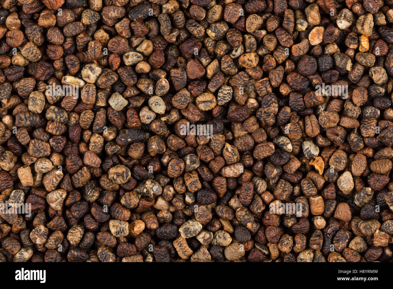 Decorticated cardamom seeds close up image can be used for background ...