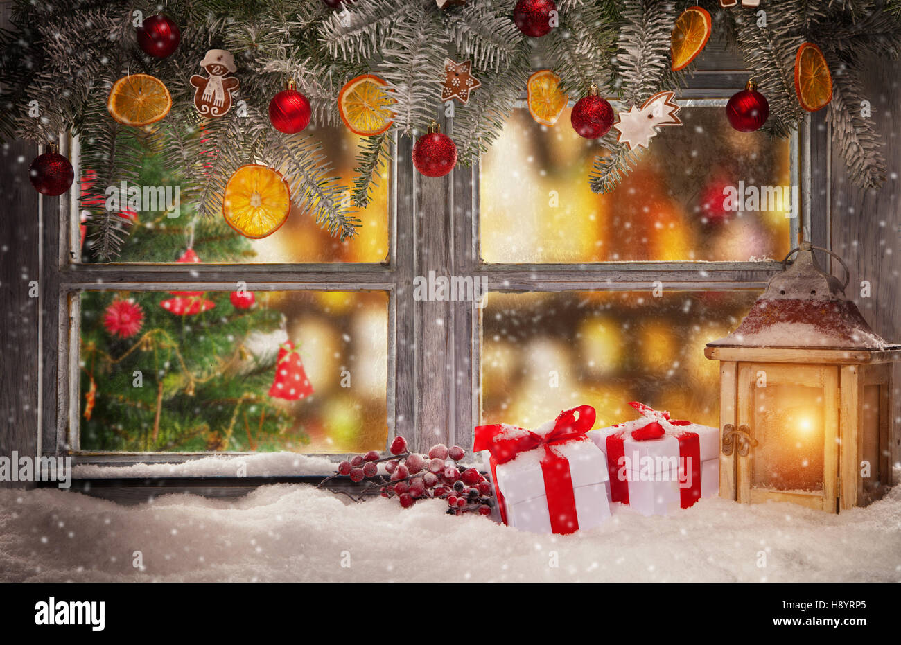 Vintage wooden window overlookhome interior with christmas tree ...