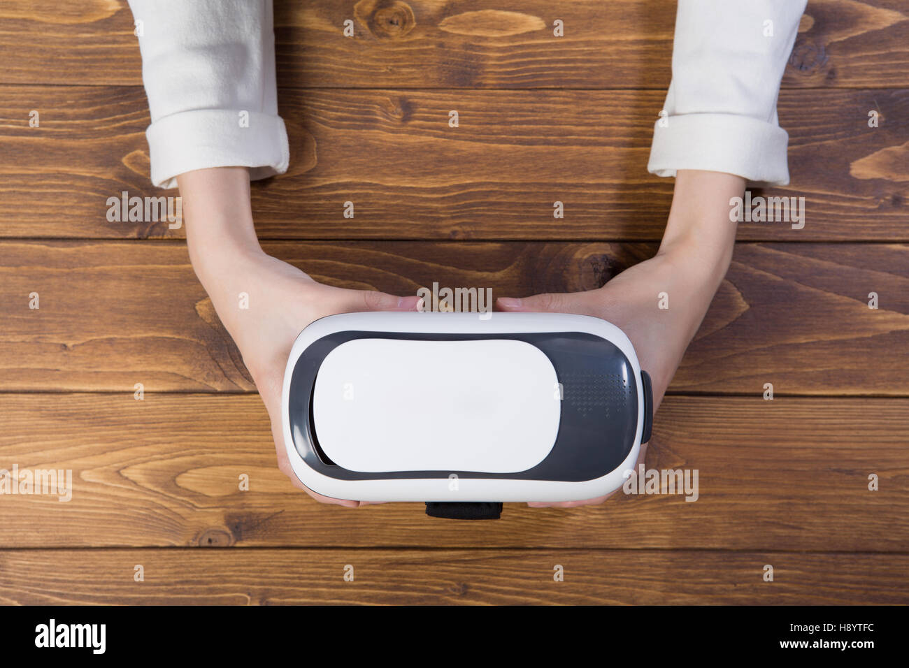 two hands holding VR headset with only hands can be seen, isolated on ...