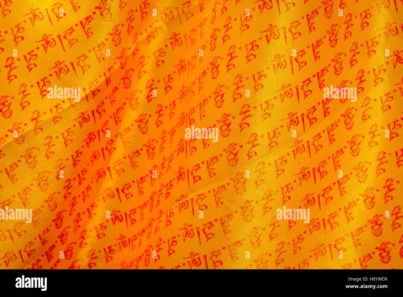 Close up of buddhist prayers on the yellow orange praying flag Stock ...
