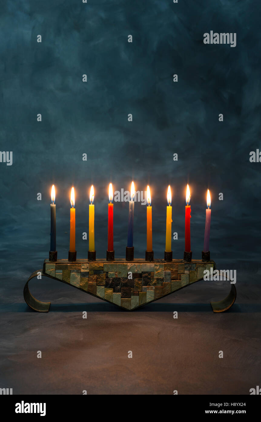 Menorah with burning candles for Hanukkah in dark Stock Photo - Alamy