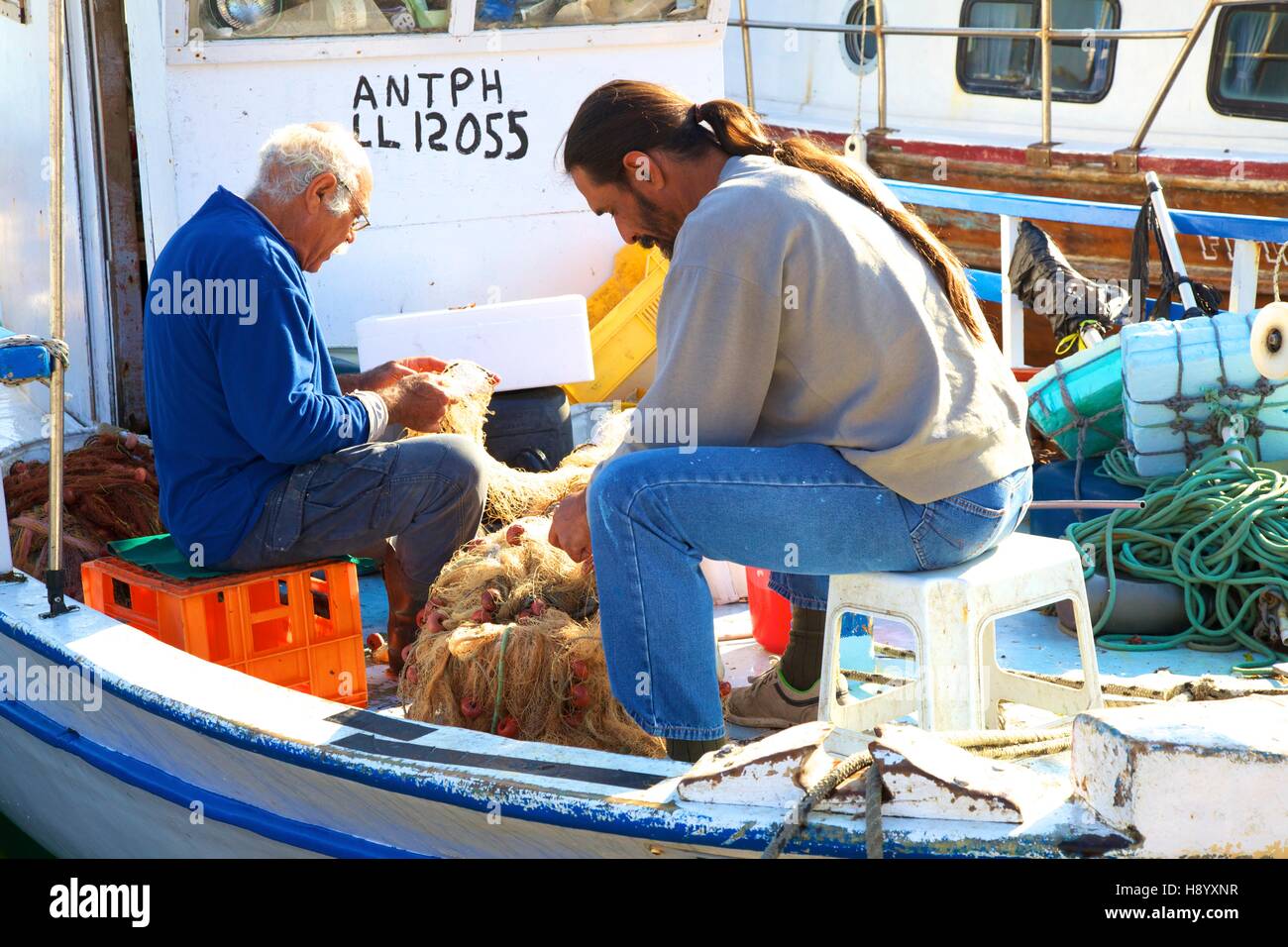 Net mending fisher hi-res stock photography and images - Alamy