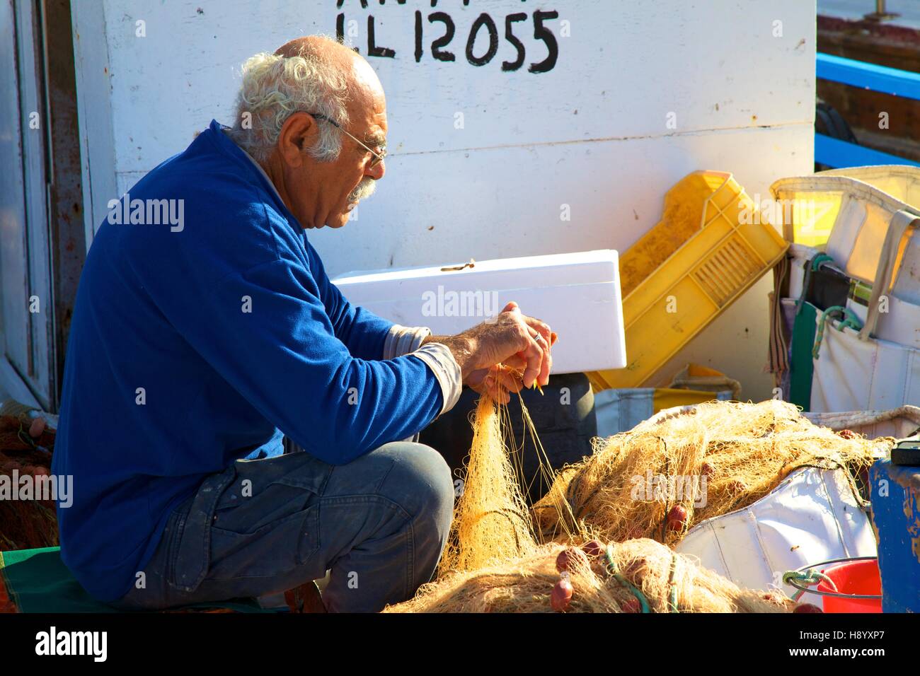 Mending fishing net hi-res stock photography and images - Alamy