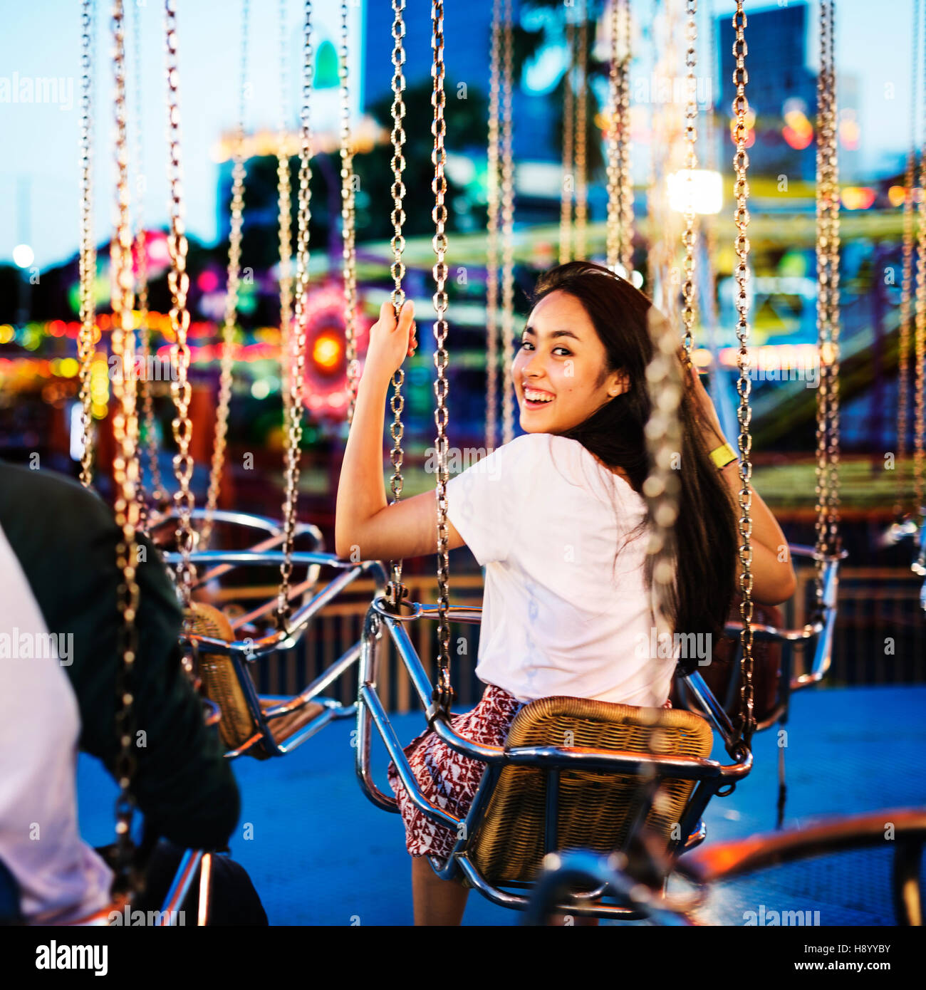 Woman Carnival Ride Riding Happiness Fun Concept Stock Photo - Alamy