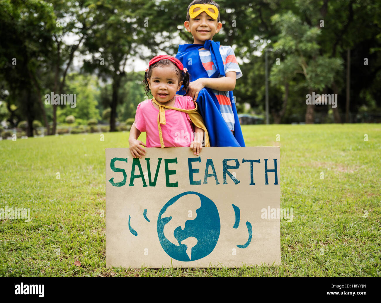 Save Earth Global Environment Boy girl Concept Stock Photo - Alamy