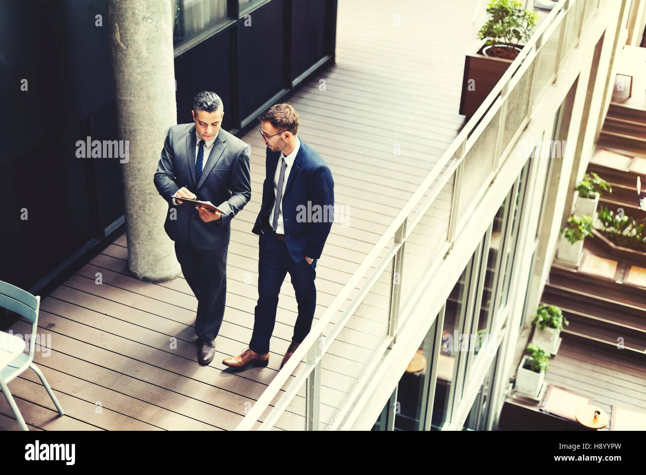 Businessman Walking Discussion Talking Work Concept Stock Photo - Alamy