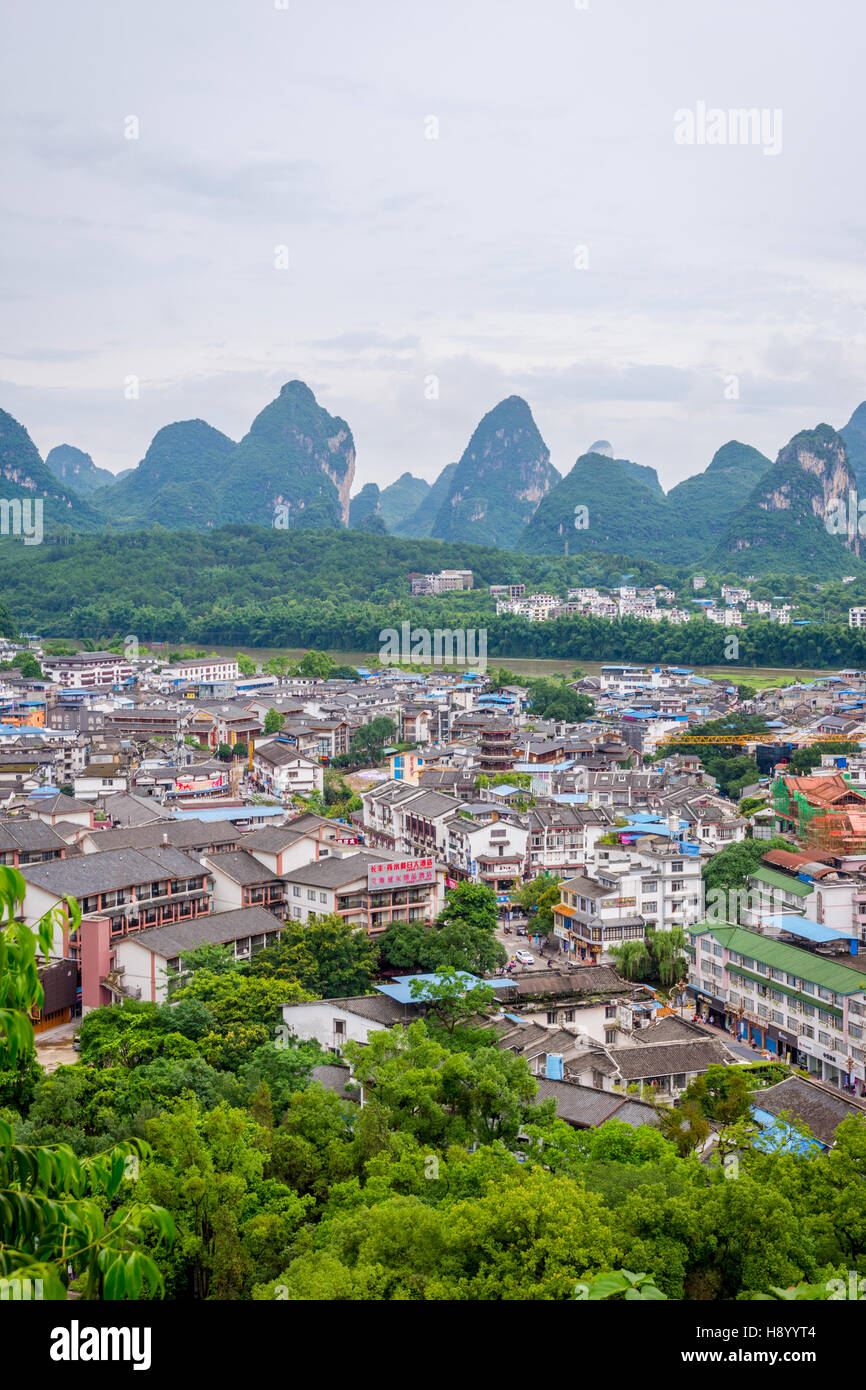 YANGSHUO, CHINA - JUNE 12: View over skyline of Yangshuo surrounded ...