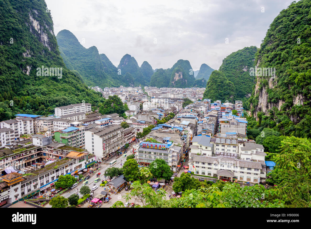 YANGSHUO, CHINA - JUNE 12: View over skyline of Yangshuo surrounded ...
