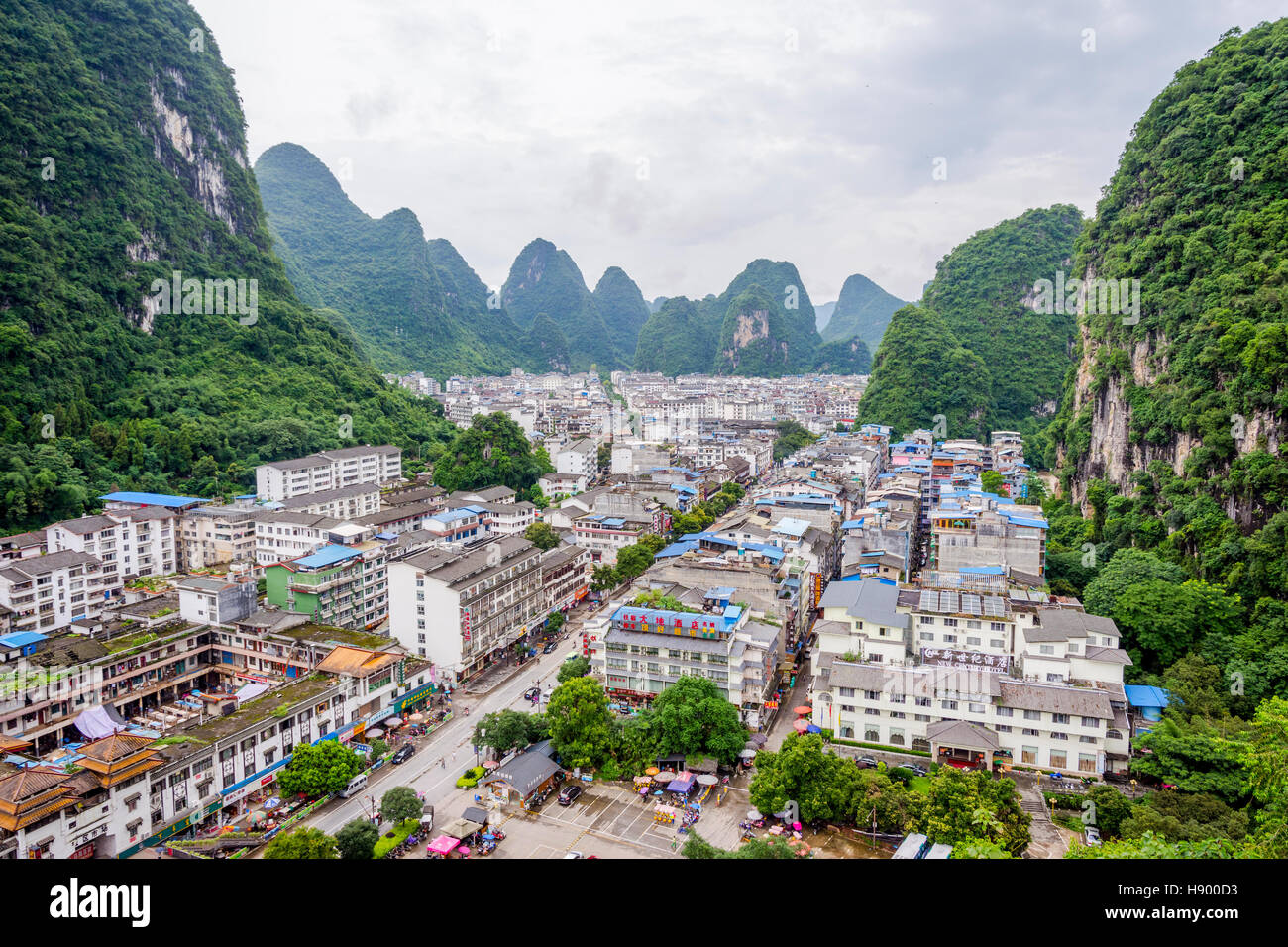 YANGSHUO, CHINA - JUNE 12: View over skyline of Yangshuo surrounded ...