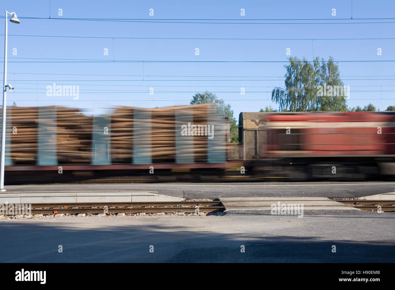 Timber in moving railroad box cars, Finland Stock Photo - Alamy
