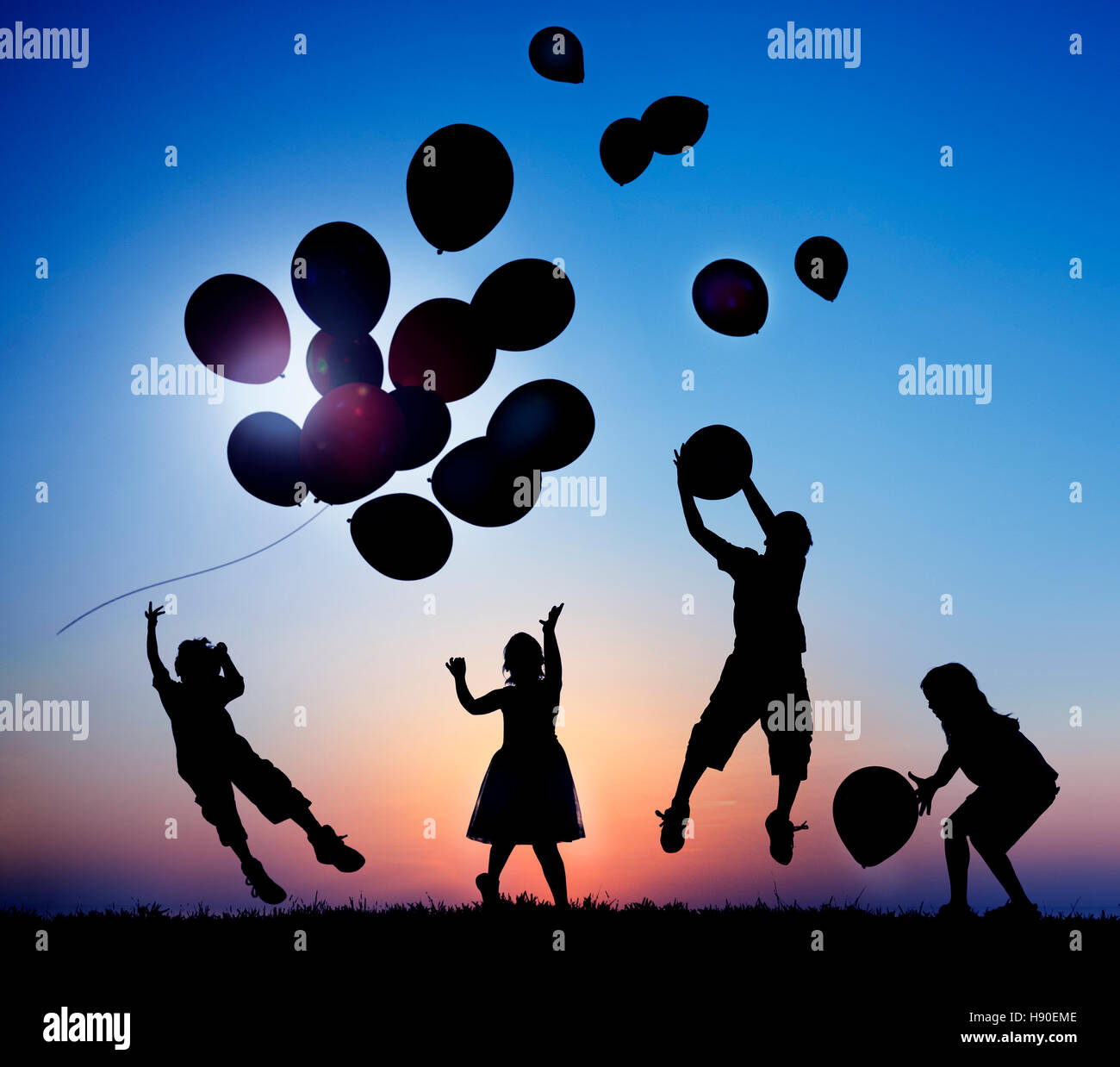 Children Kids Playing Balloons Innocence Concept Stock Photo - Alamy