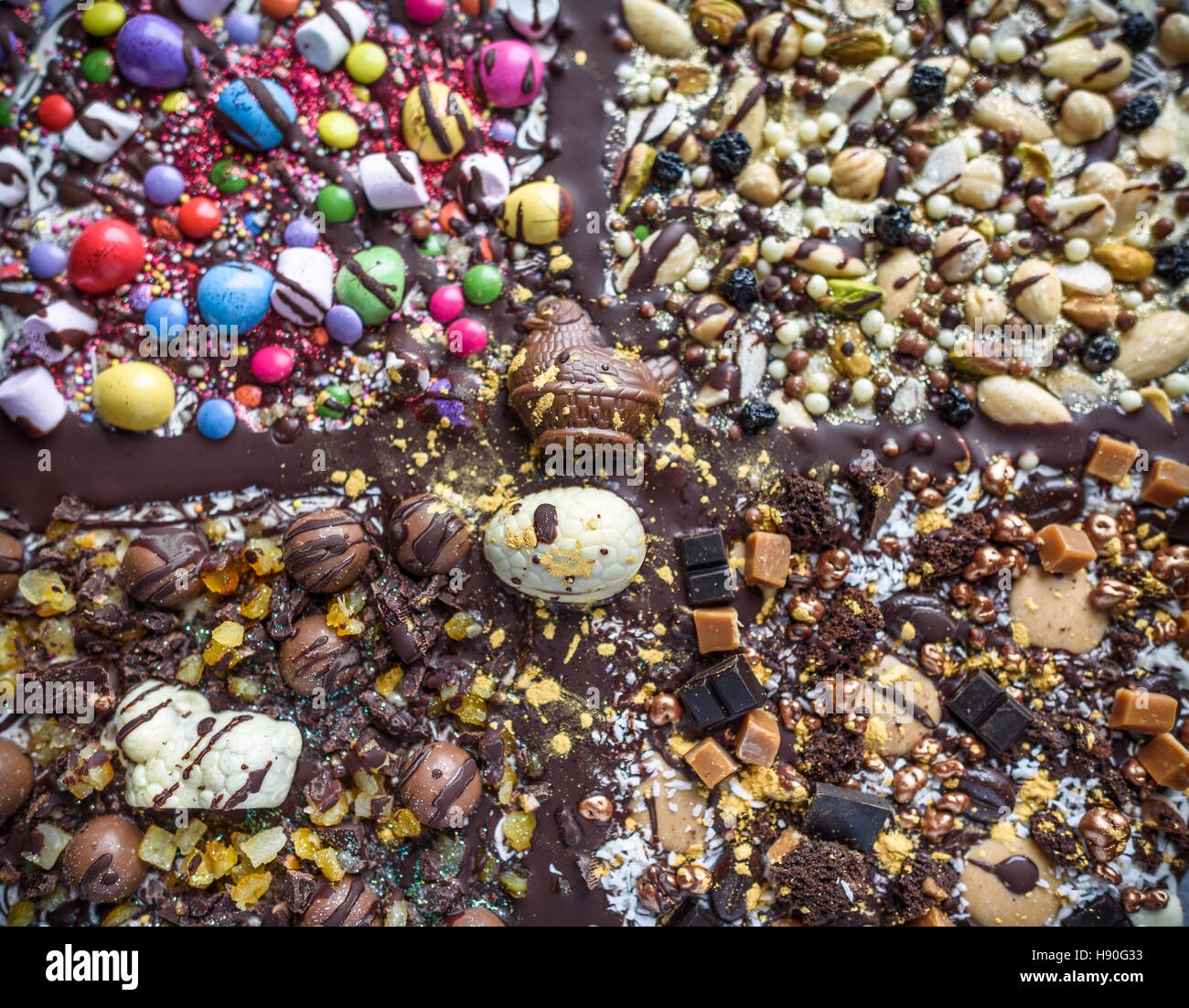Easter explosive, abstract mix of chocolate, sweets and nuts around the ...