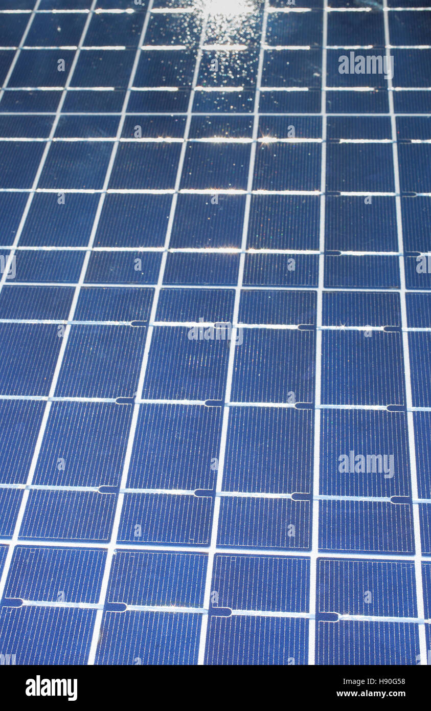 Sun finally striking the end of a solar panel Stock Photo - Alamy