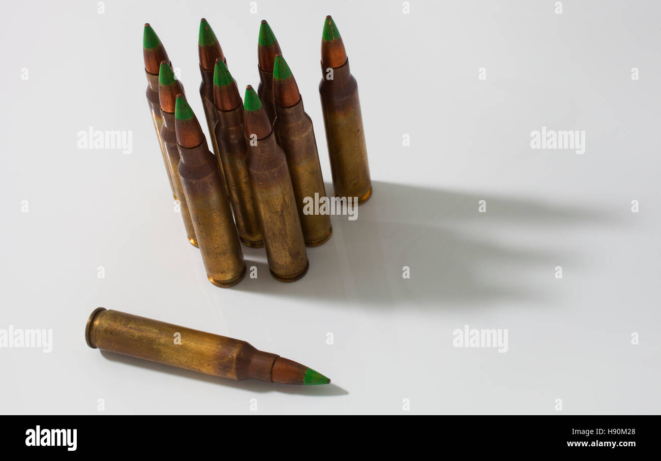 Rifle cartridges with bullets that have a green tip Stock Photo - Alamy