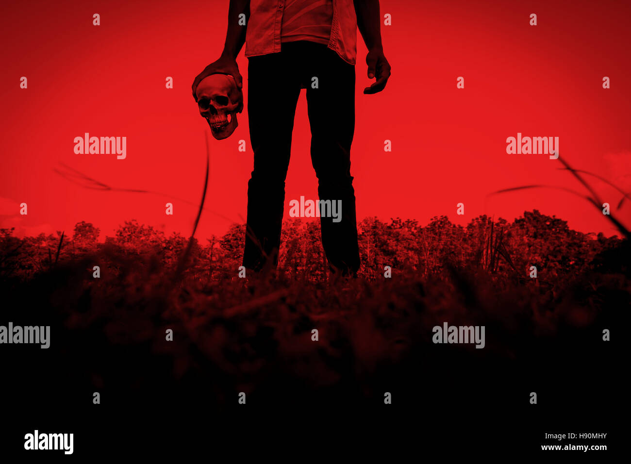 Release evil,Person with human skull in hand,Scary background for ...