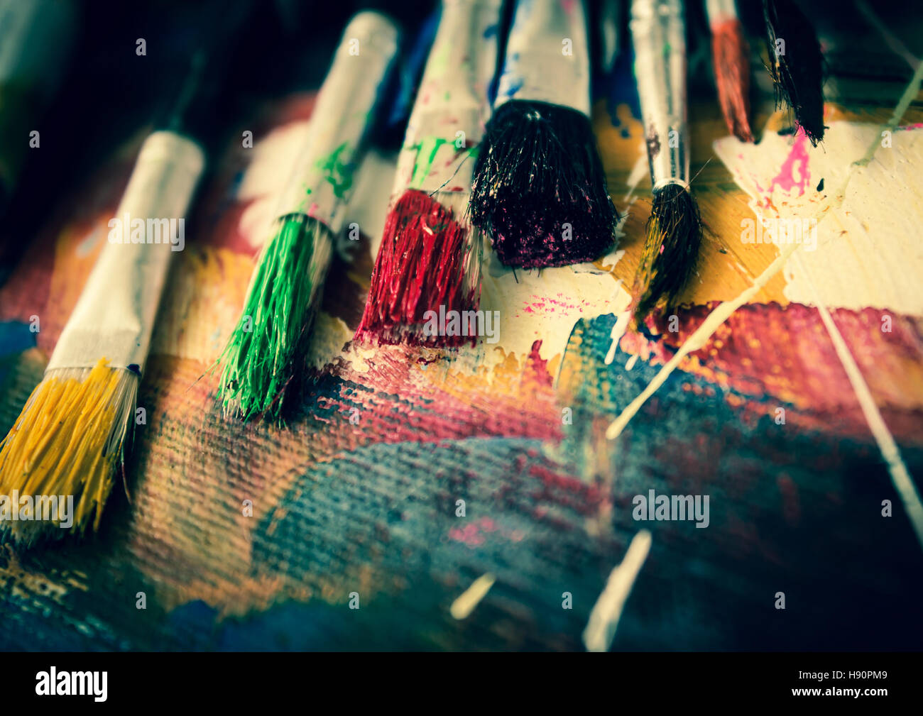 Artist paint brush on painting background Stock Photo - Alamy