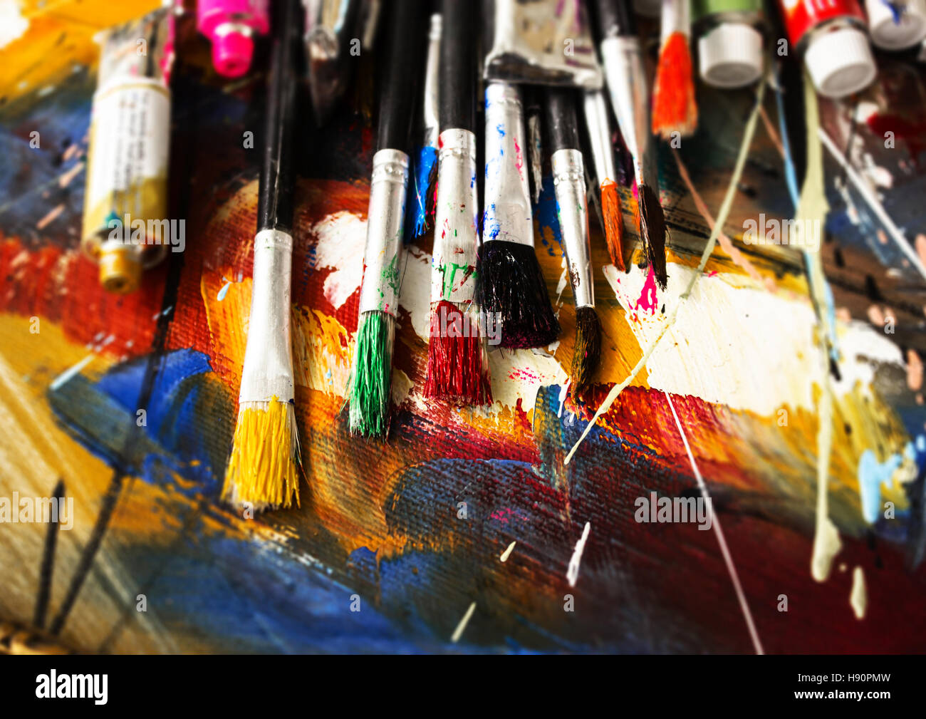 Artist paint brush on painting background Stock Photo - Alamy