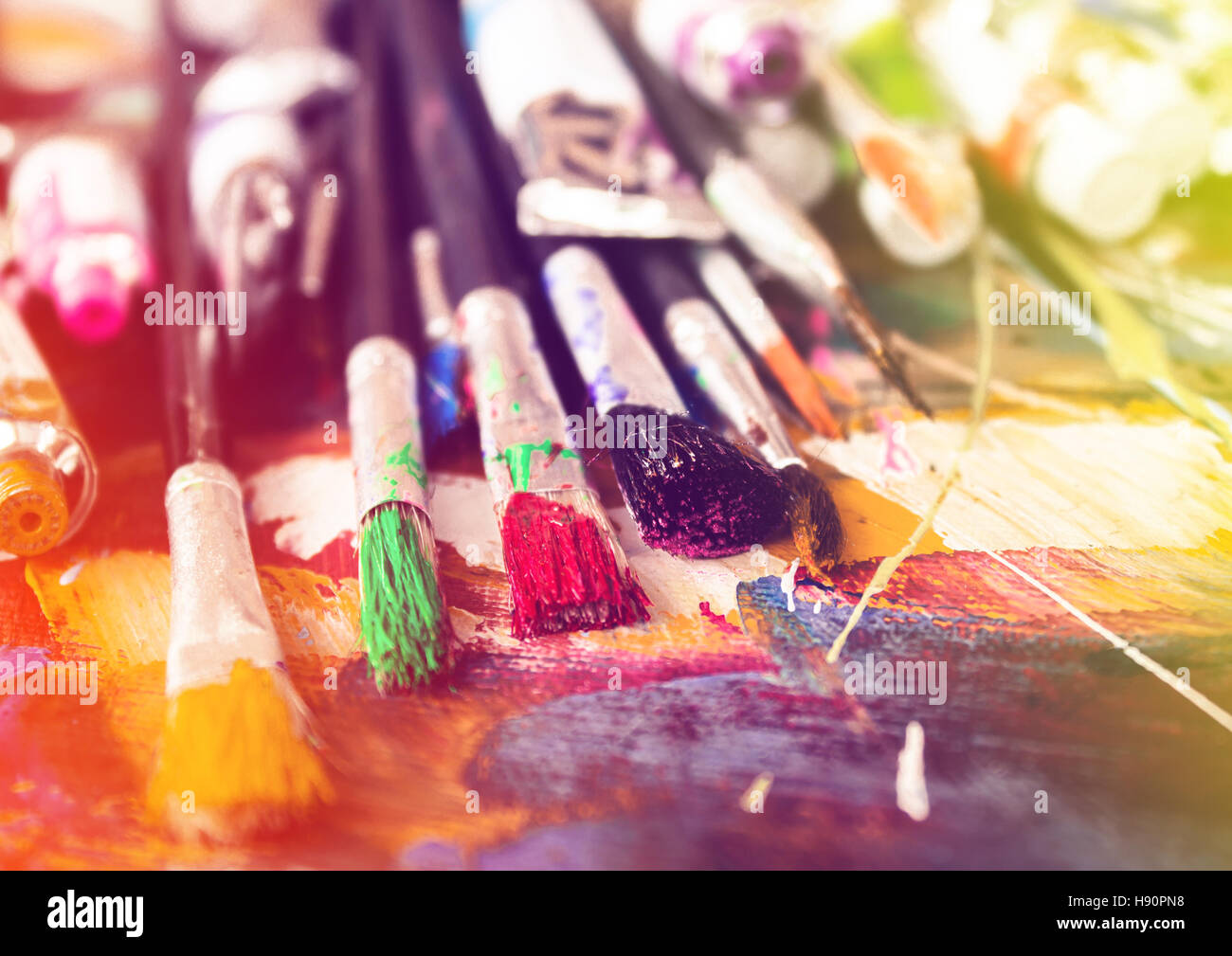 Artist paint brush on painting background Stock Photo - Alamy