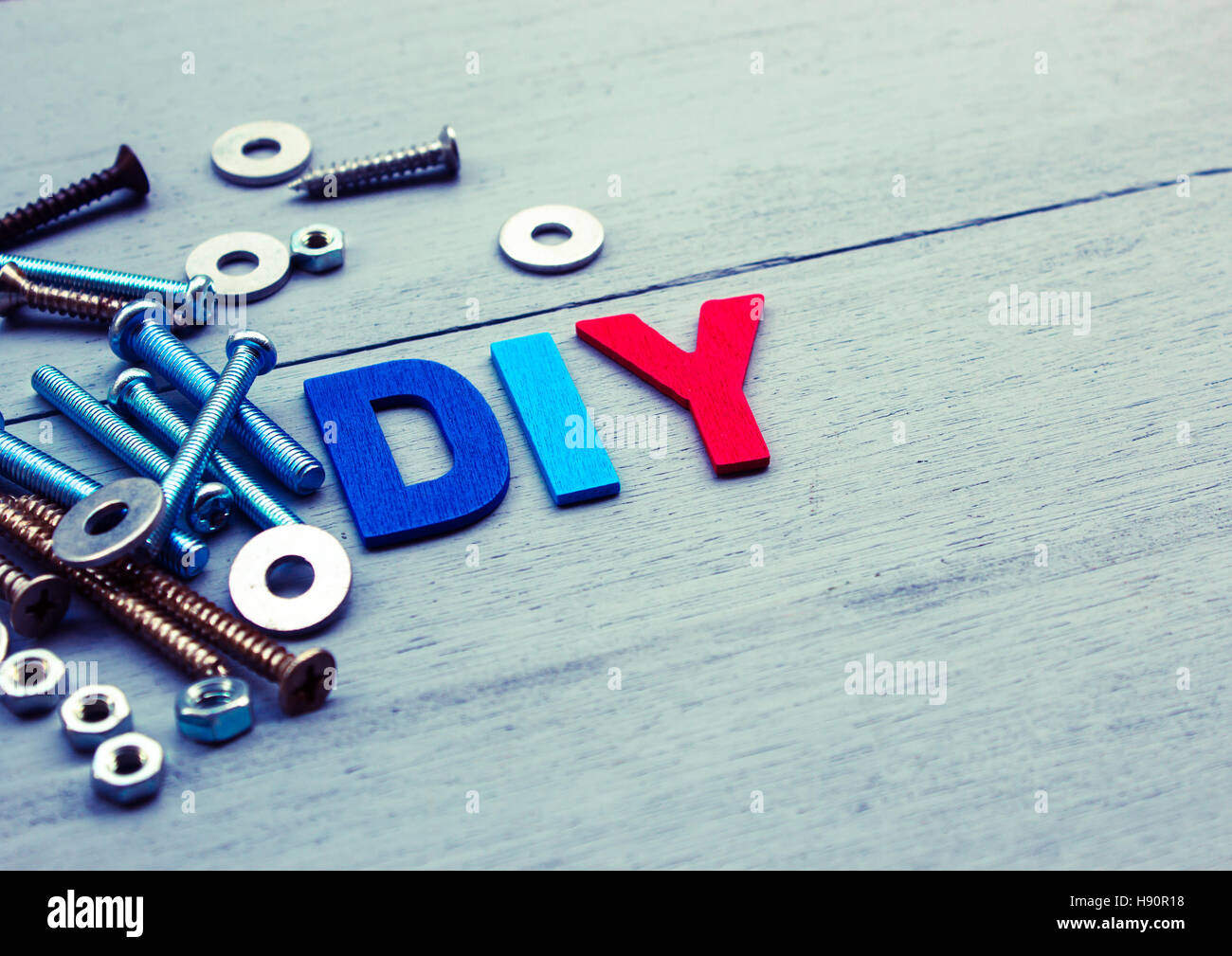 Diy text on wooden floor with screw and washer Stock Photo - Alamy