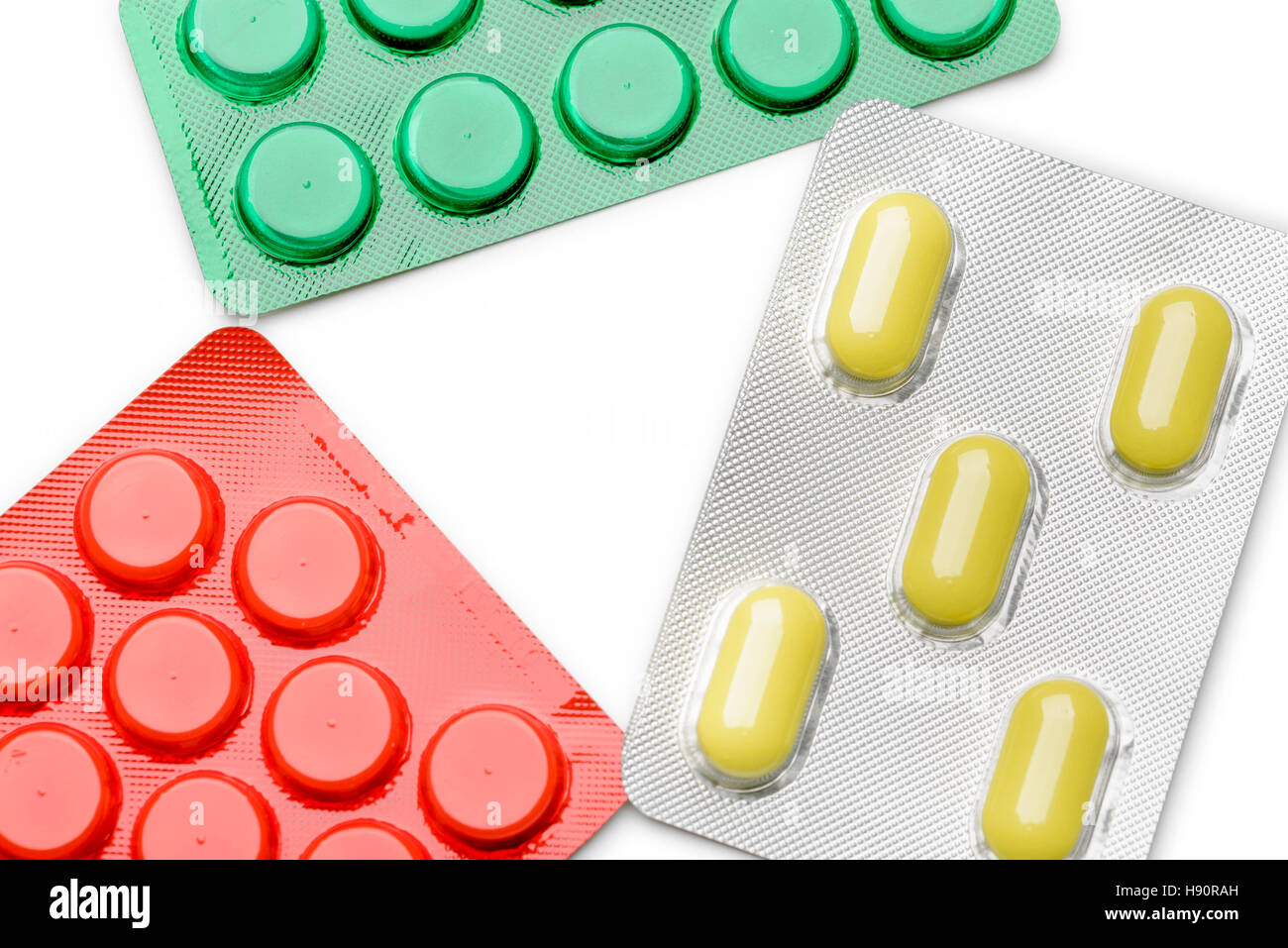 Red, yellow, green and white pills blisters of pharmacy to cure pain ...