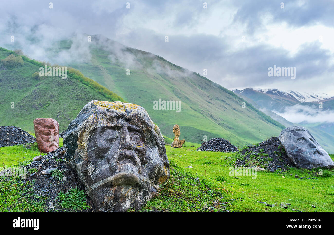 The monumental stone heads of the famous poets and writers in misty ...