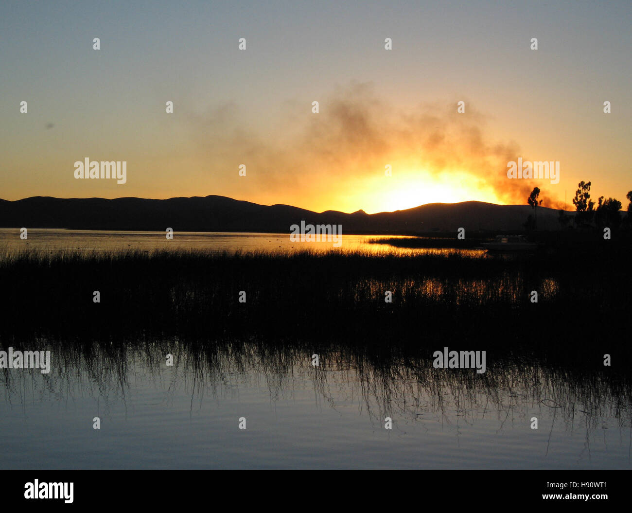 A sunset over Titicaca lake Stock Photo - Alamy