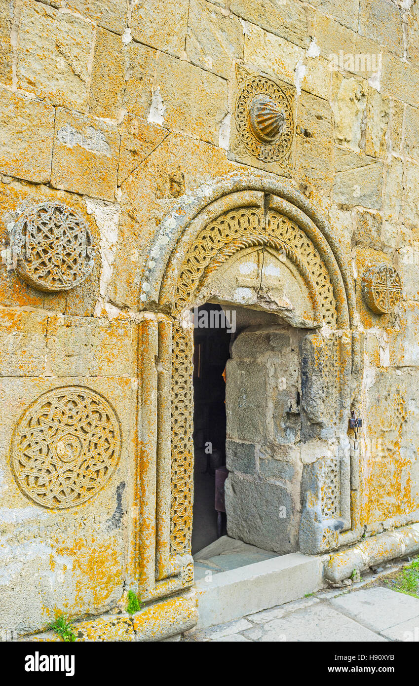 The entrance to Tsminda Sameba (Holy Trinity) Church decorated with the ...