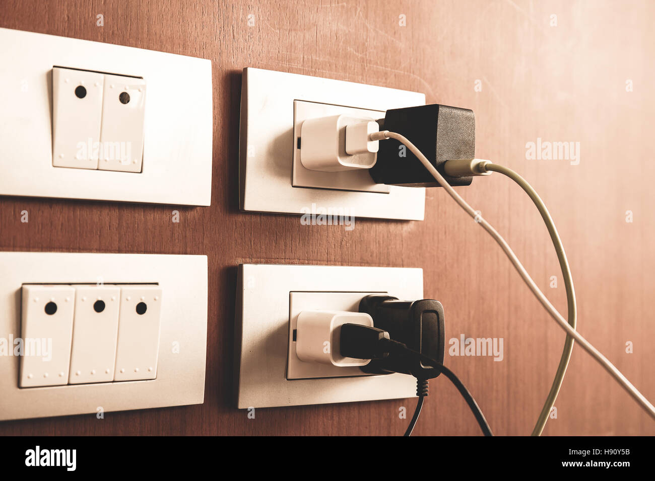 Plug the battery charger Stock Photo - Alamy