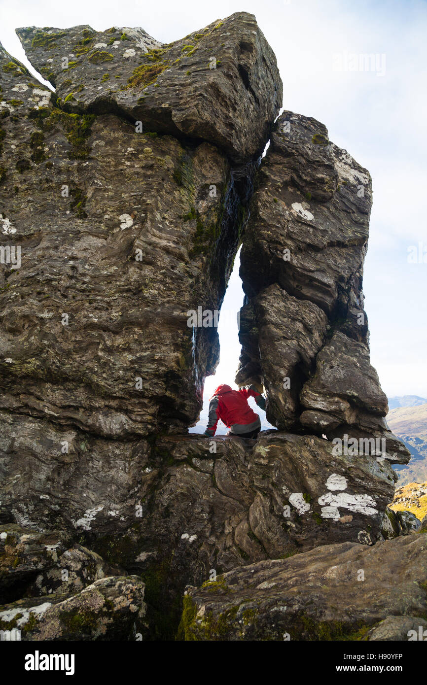 A walker threading the needle on The Cobbler Mountain Scotland Stock ...