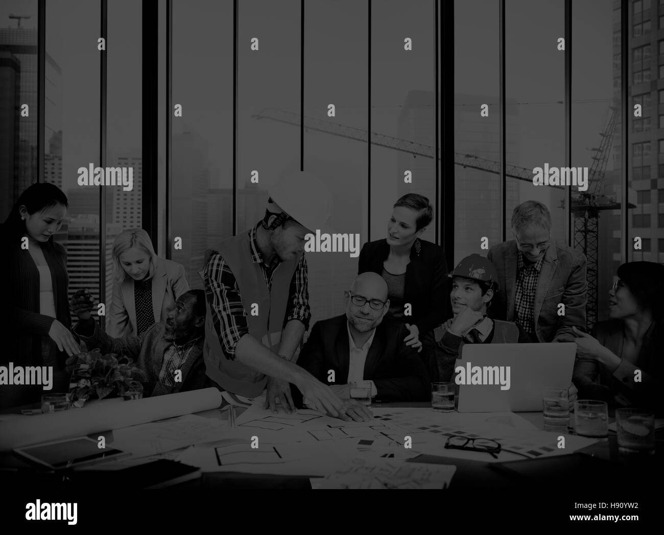 Blueprint meeting business people Black and White Stock Photos & Images ...