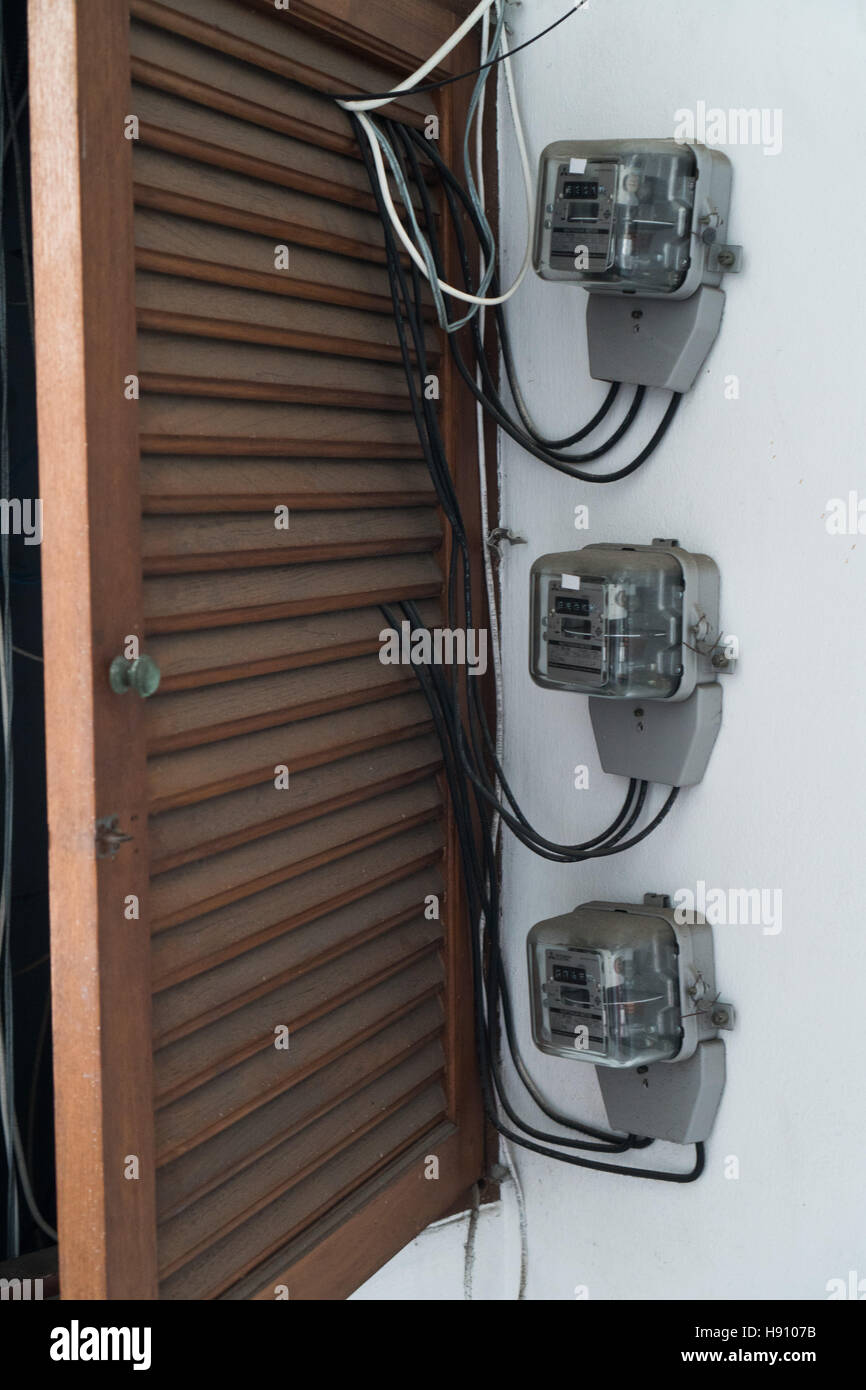 Electric meters hanging outside the power box Stock Photo - Alamy