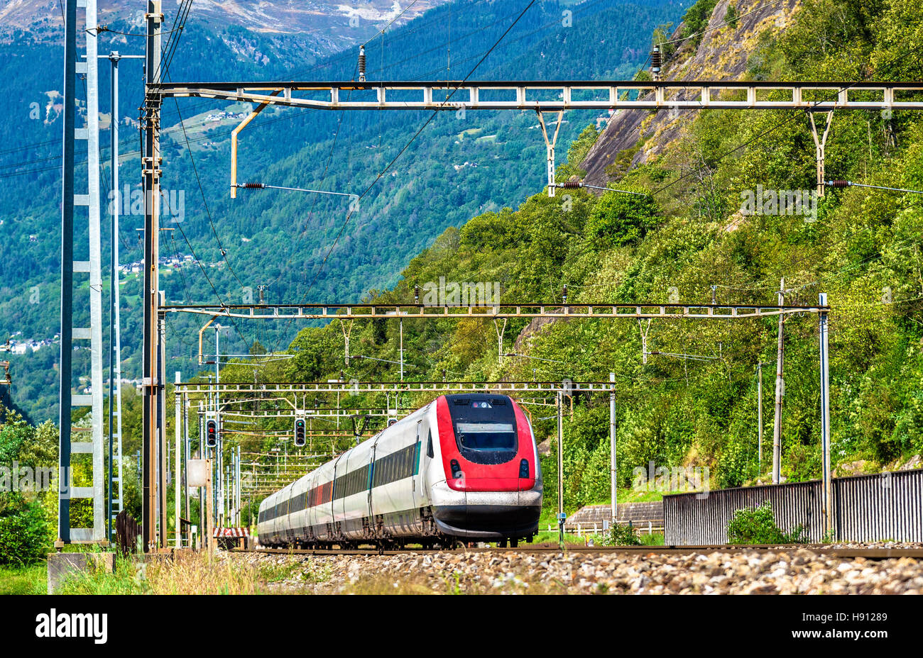 Tilting high-speed train on the Gotthard railway Stock Photo - Alamy