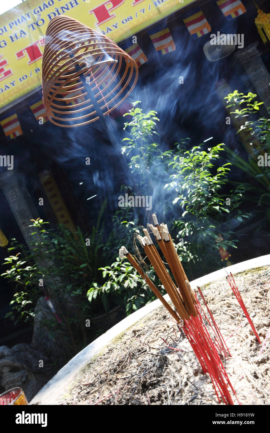 Dragon face is formed by incense's smoke at Chua Ba Da - Buddhist ...