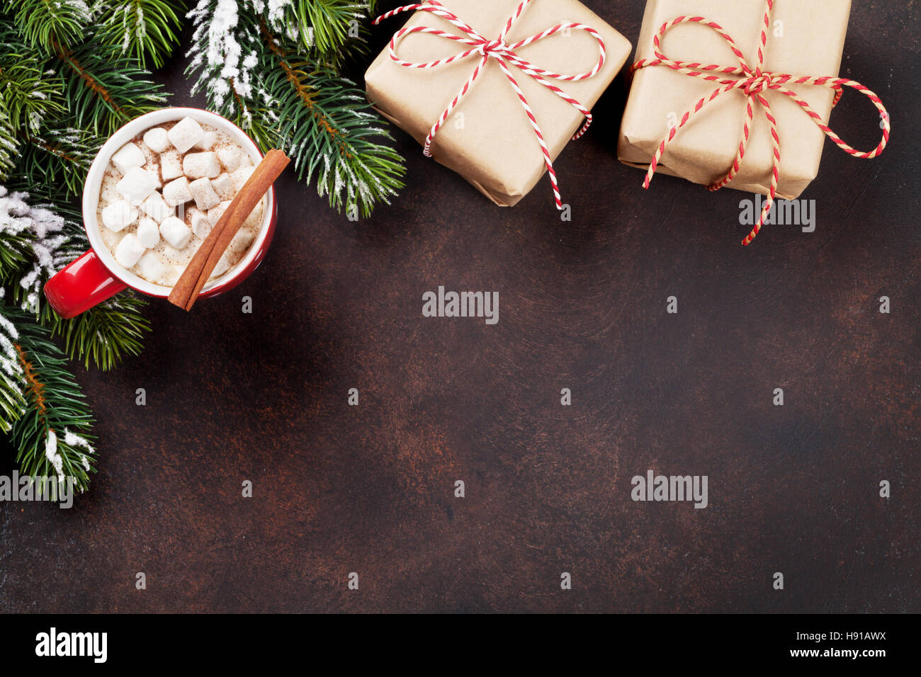 Christmas background with gift boxes, fir tree, hot chocolate and ...