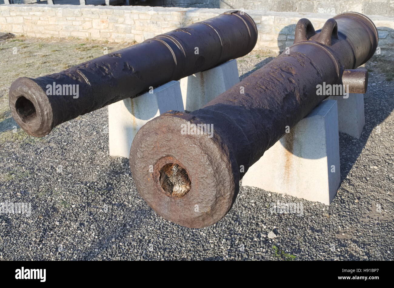 Two Old Rusty Naval Artillery Cannons on White Stone Pedestal Stock ...