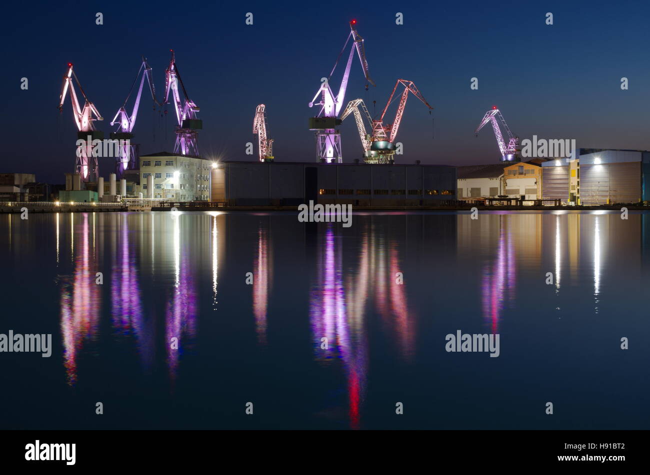 Colorfully Lit Dock Cranes in Pula Croatia at Night Stock Photo - Alamy