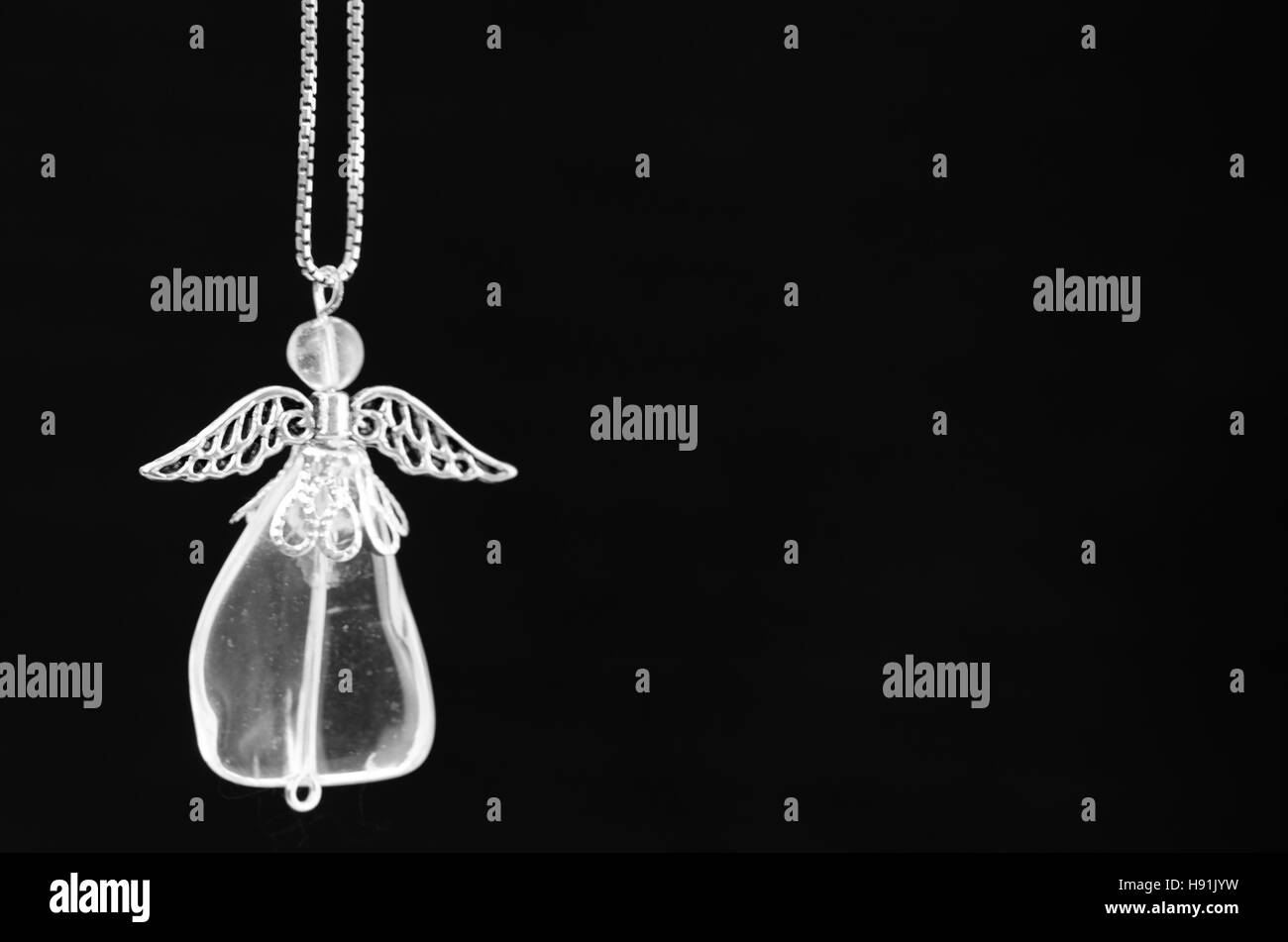 crystal angel decoration against blue background Stock Photo - Alamy