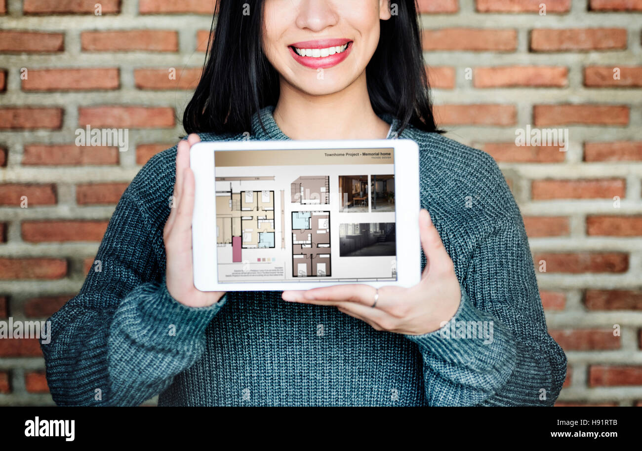Asian Lady Showing Floor Plan on Tablet Concept Stock Photo - Alamy