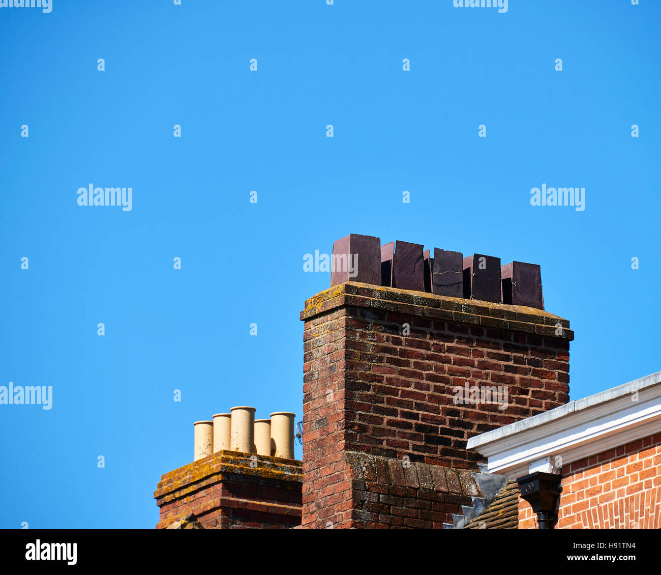 Five Terracota Chimney pots and 5 Chimney Pots made from slate on two ...