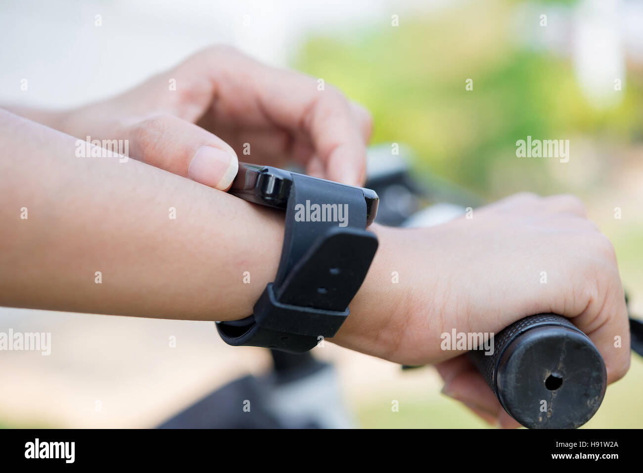 Close-up smart watch on arm women to ride a bicycle Stock Photo - Alamy