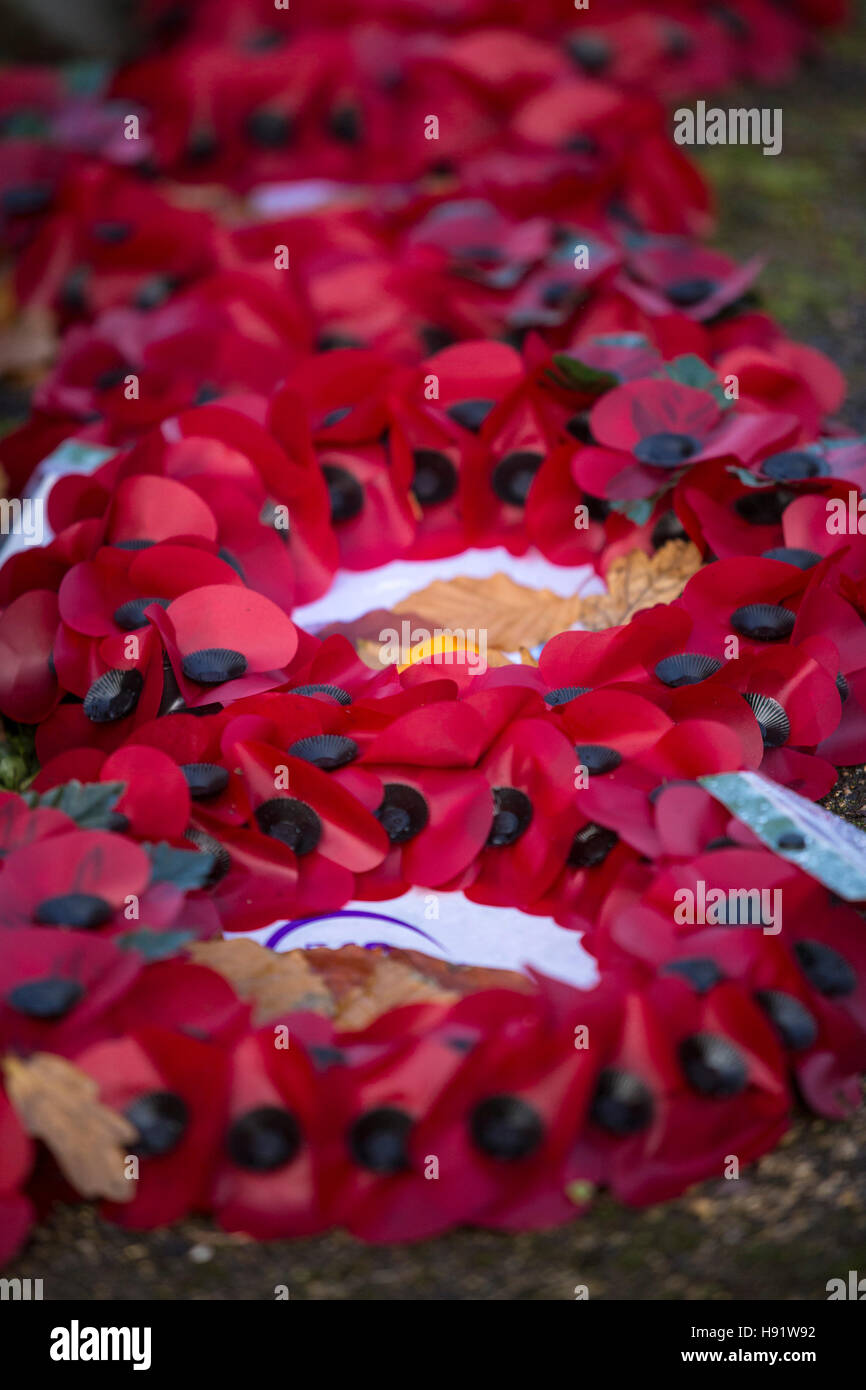 Poppy wreaths laid at the base of a war memorial Stock Photo - Alamy