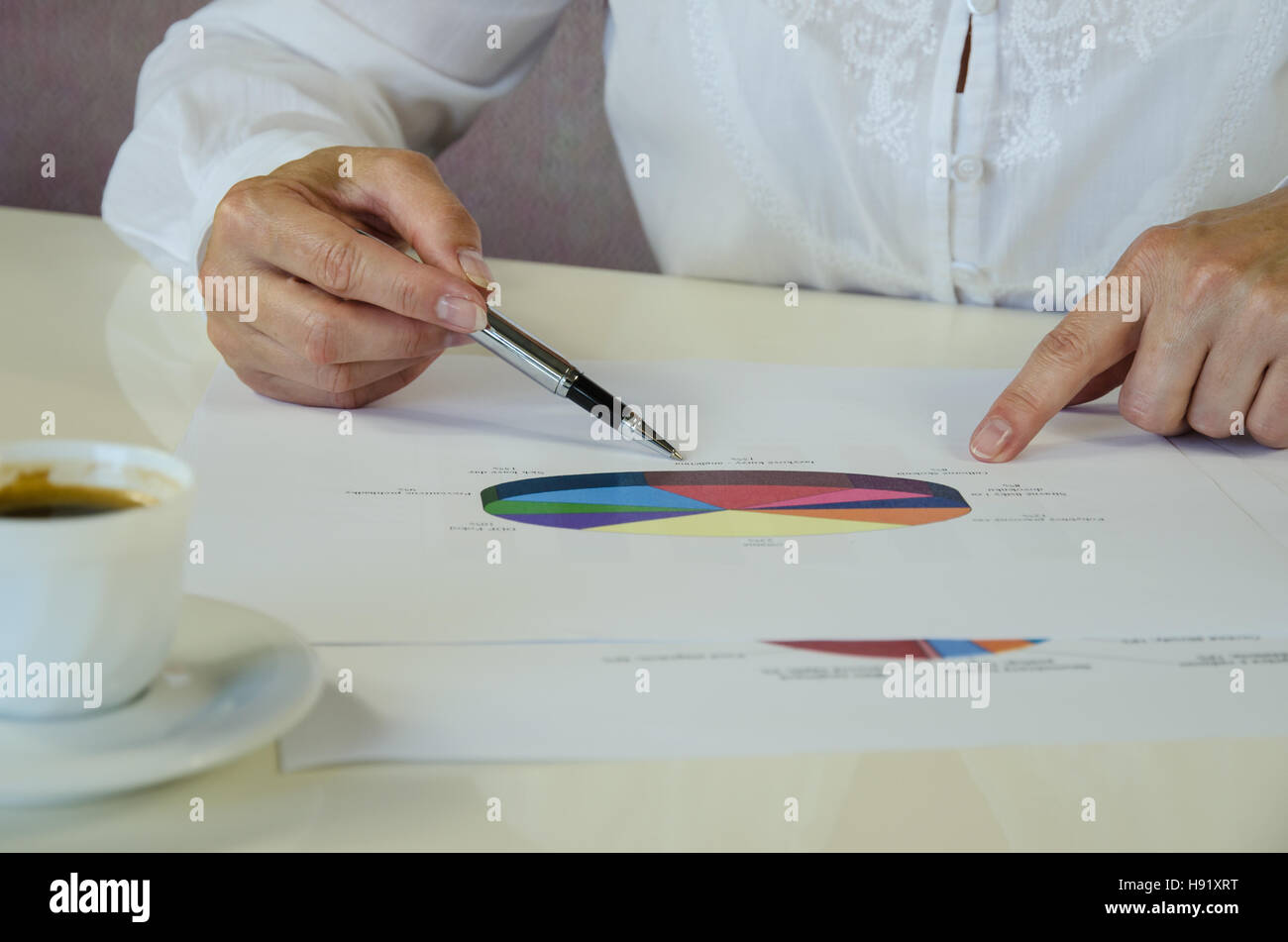 hand with pen and colorful chart Stock Photo - Alamy