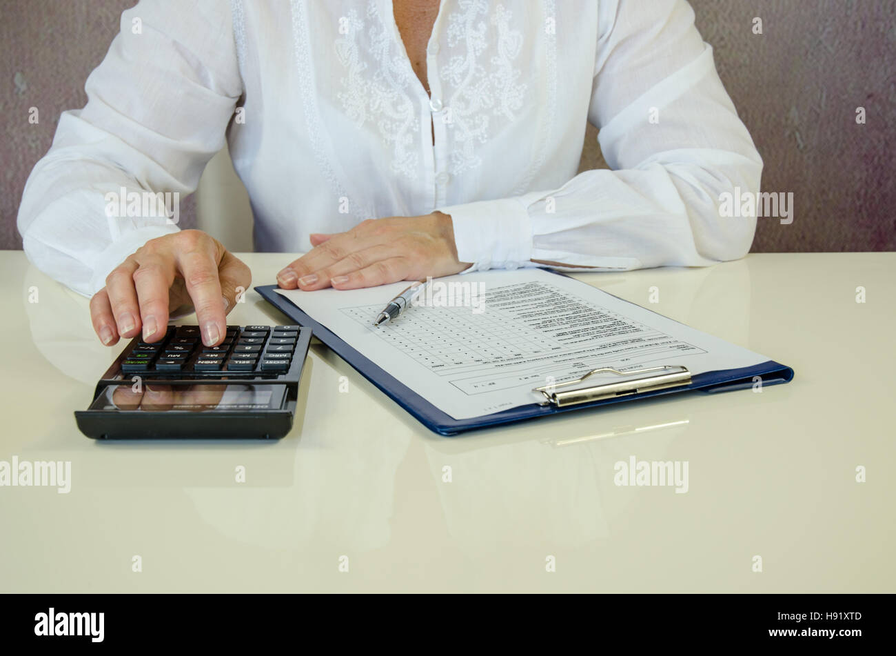 hand over calculation and paperwork Stock Photo - Alamy